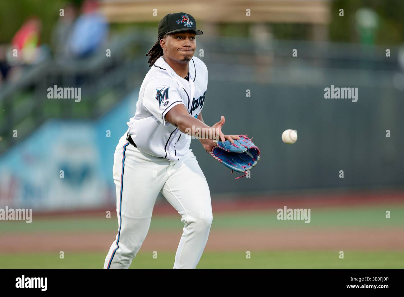 Beloit, WI. USA: Beloit Sky Carp pitcher Xavier Meachem (31) fields and ...