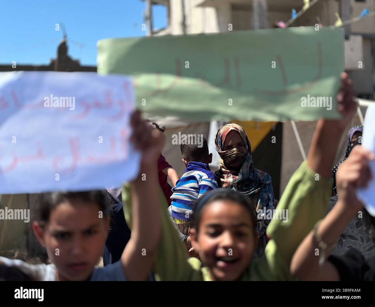 A large crowd, including children, gather, leading to chaotic scenes as ...