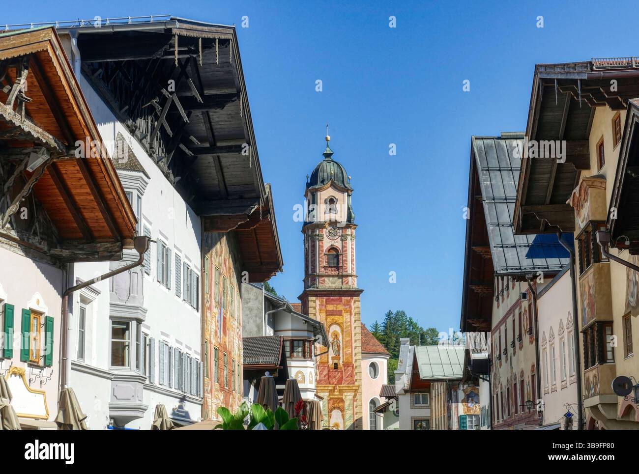 Historic street and church in the old town of Mittenwald in Bavaria ...