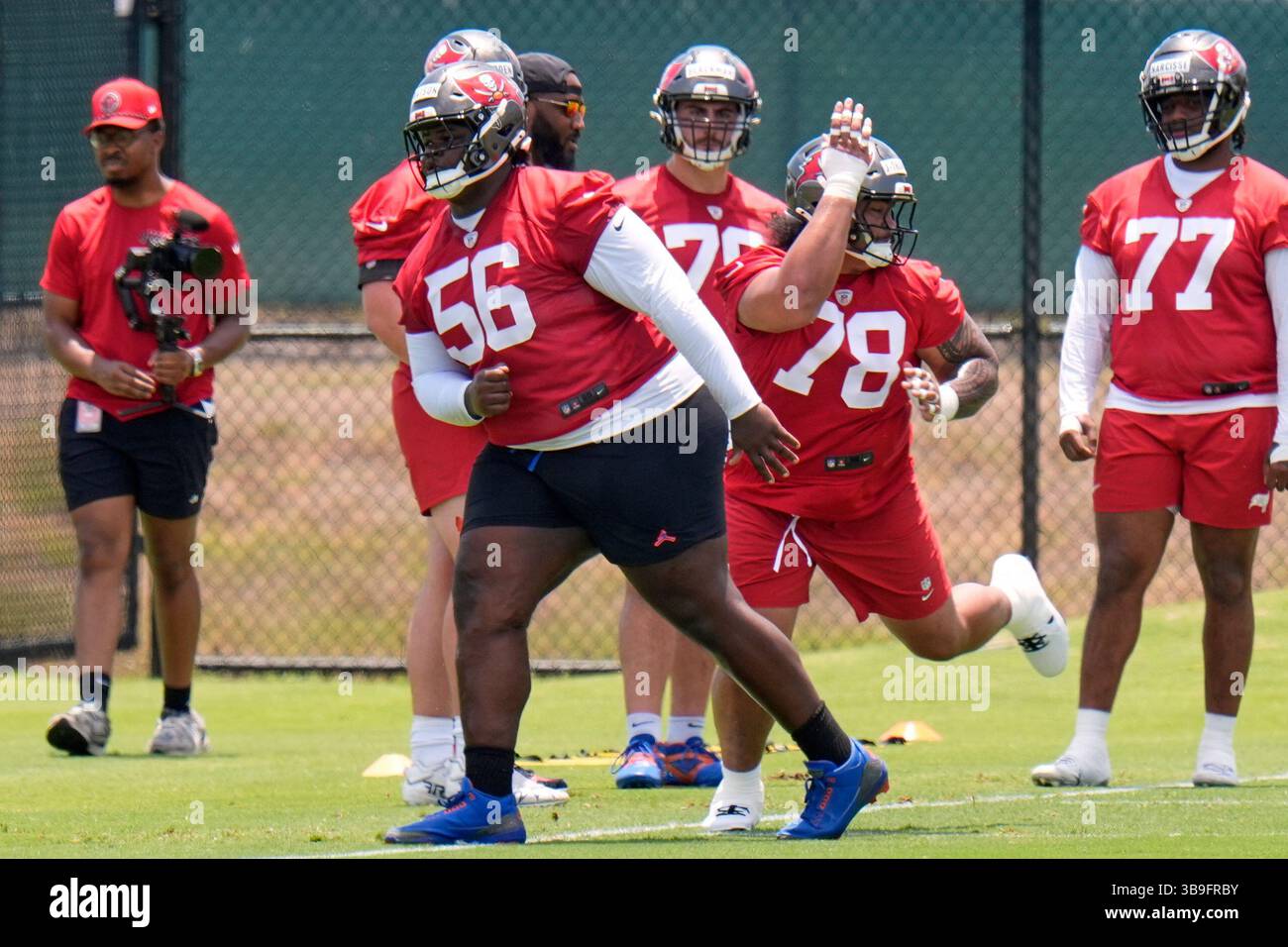 Tampa Bay Buccaneers nose tackle Desmond Watson (56) works against Dvon ...
