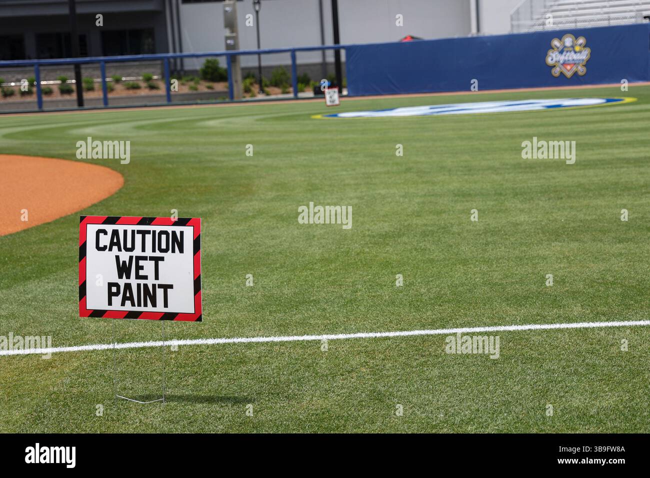 ATHENS, GA - MAY 09: A caution wet paint sign is displayed field side ...