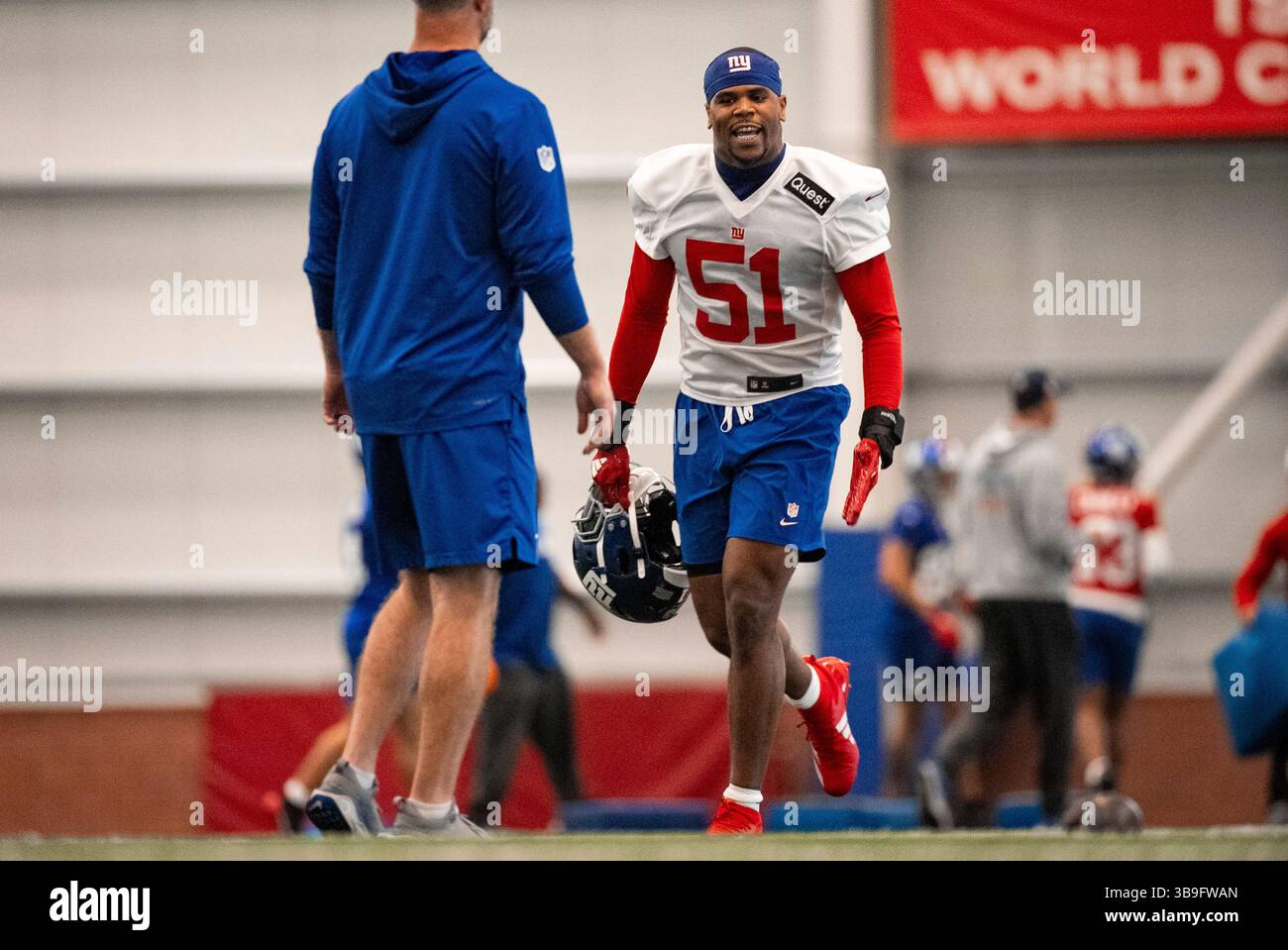 New York Giants linebacker Abdul Carter (51) greets a coach during the ...