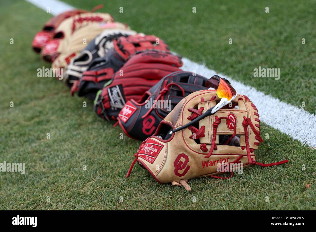 ATHENS, GA - MAY 09: Rawlings gloves with the OU logo displayed on the side are lined up on the ...
