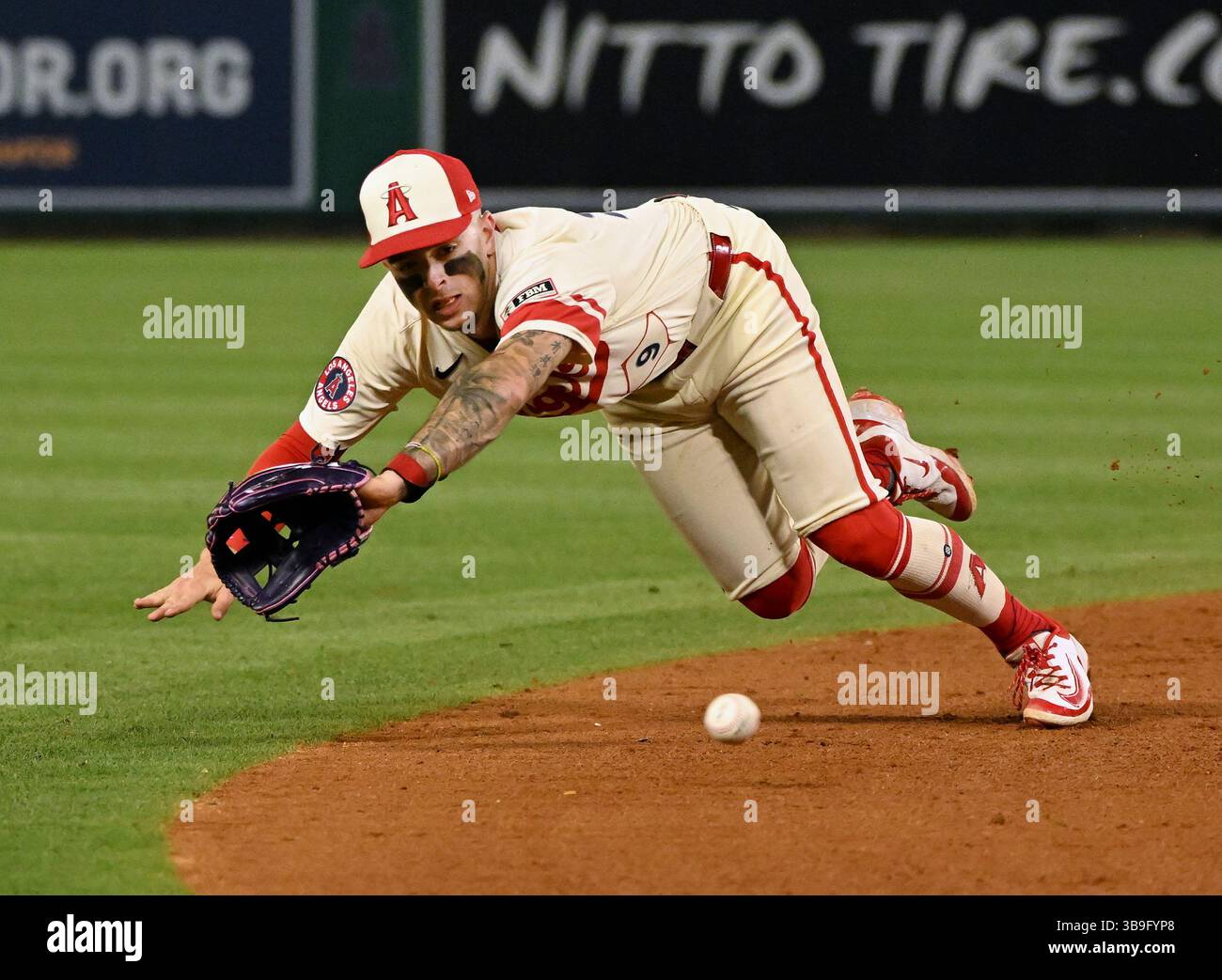 ANAHEIM, CA - MAY 08: Los Angeles Angels shortstop Zach Neto (9) dives ...