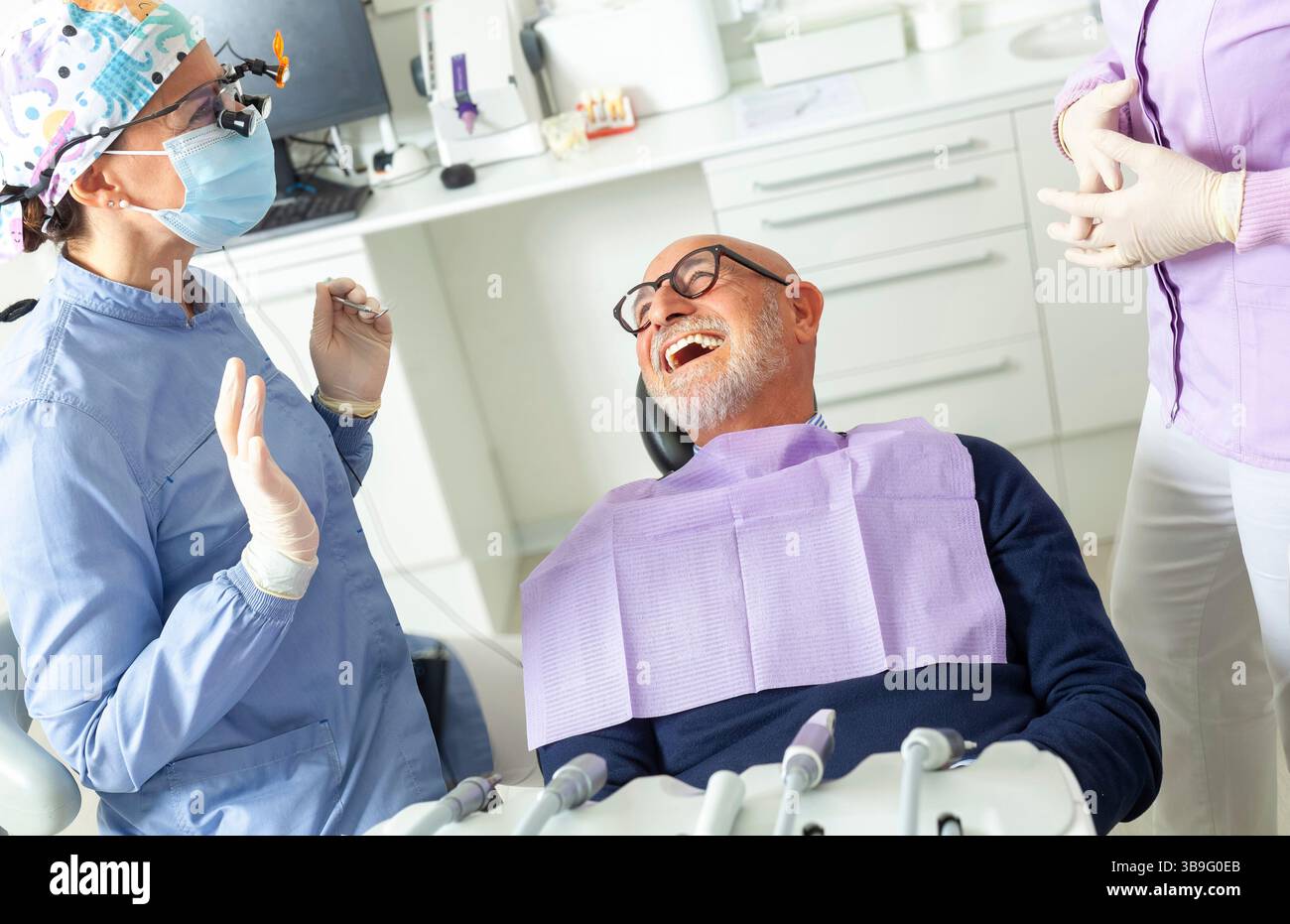 Medical professional engaging senior hi-res stock photography and ...