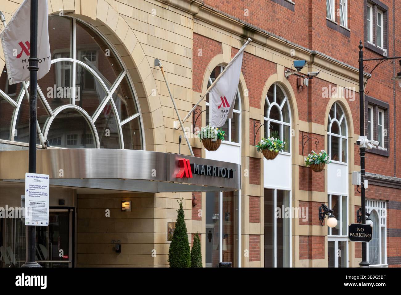 Exterior view of a Marriott hotel featuring brick facade, arched ...