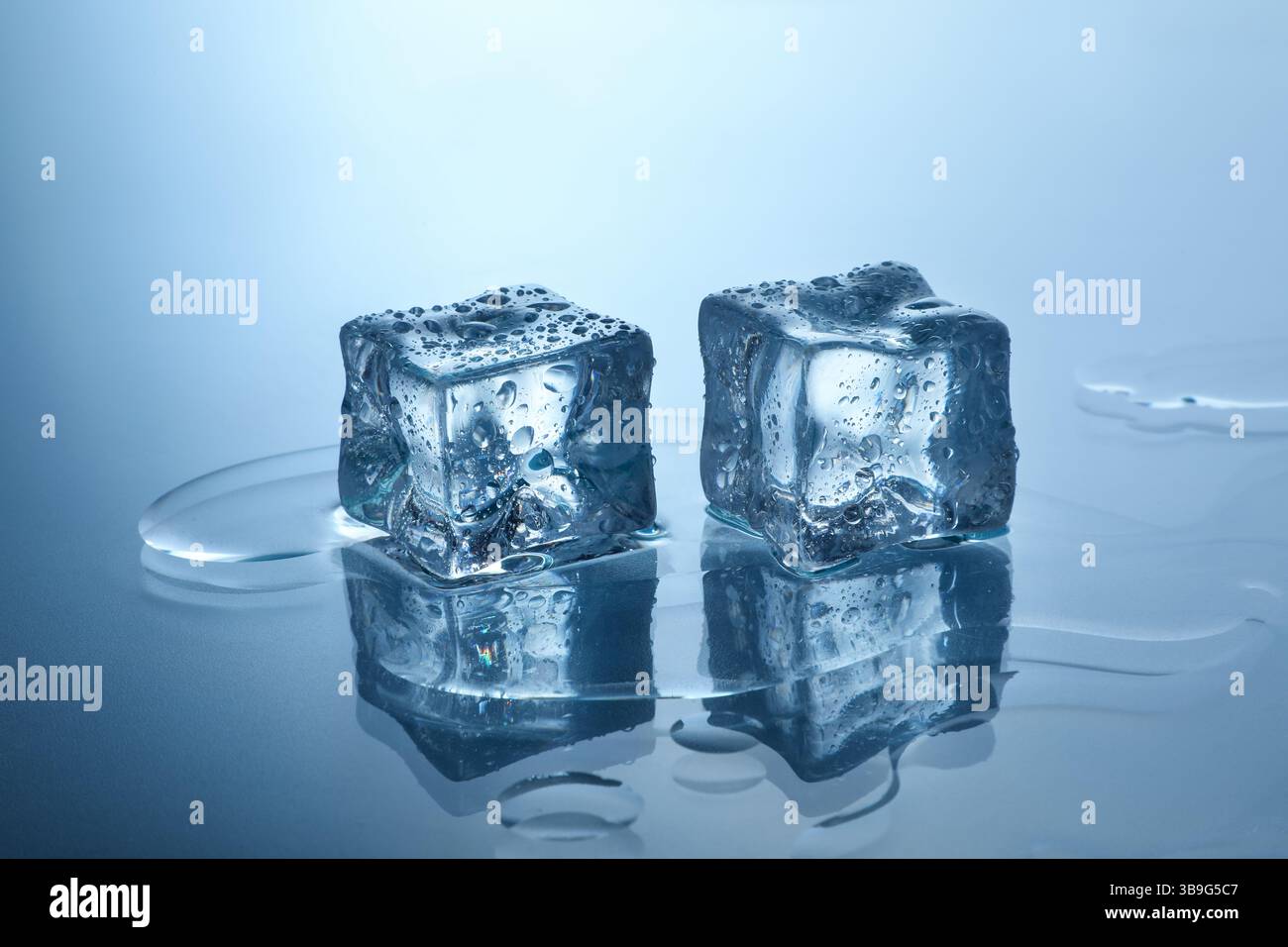 Cubes of clear ice on mirror surface Stock Photo - Alamy