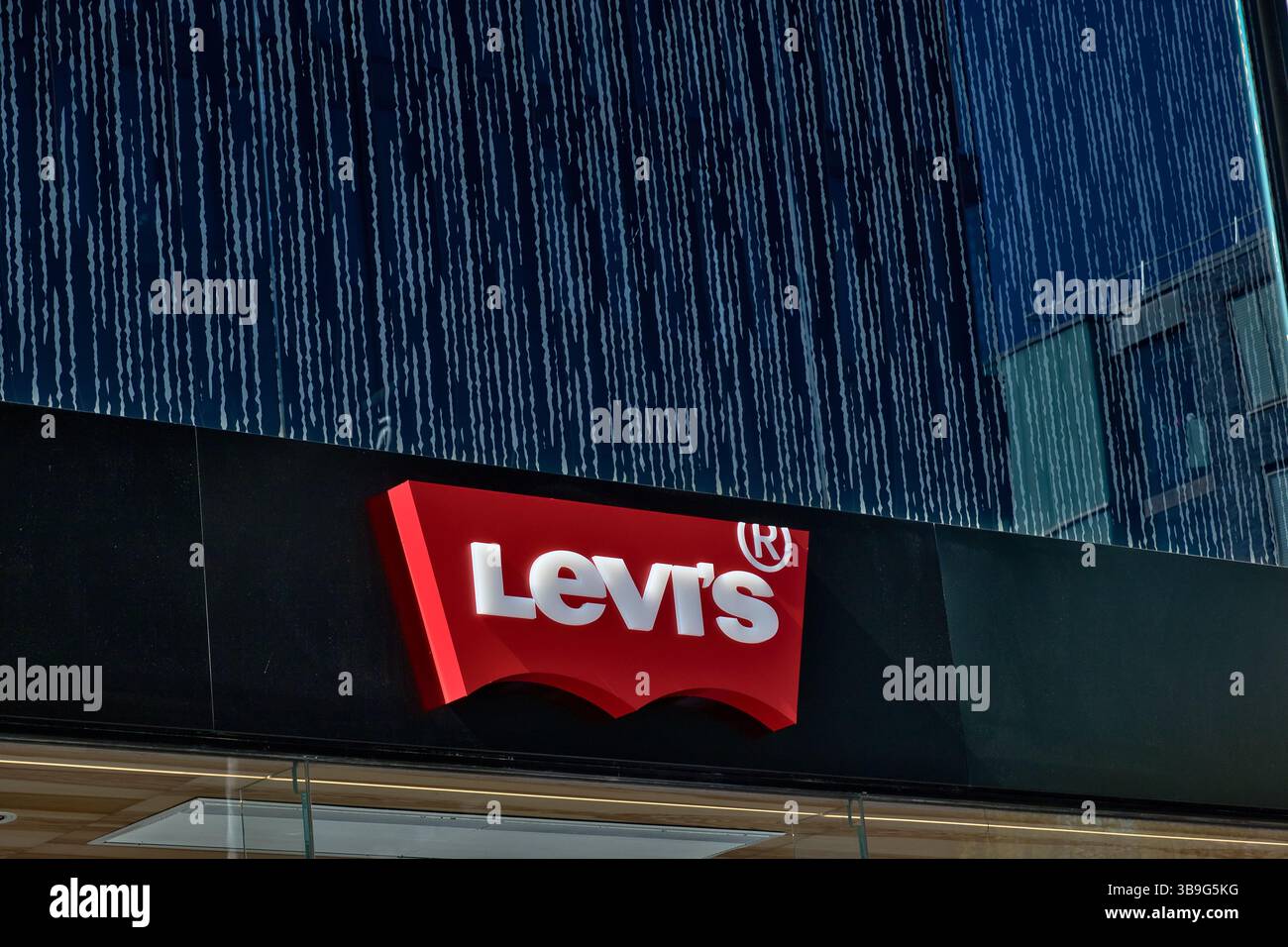 Close up of a Levi's store sign, red and white logo on a black ...