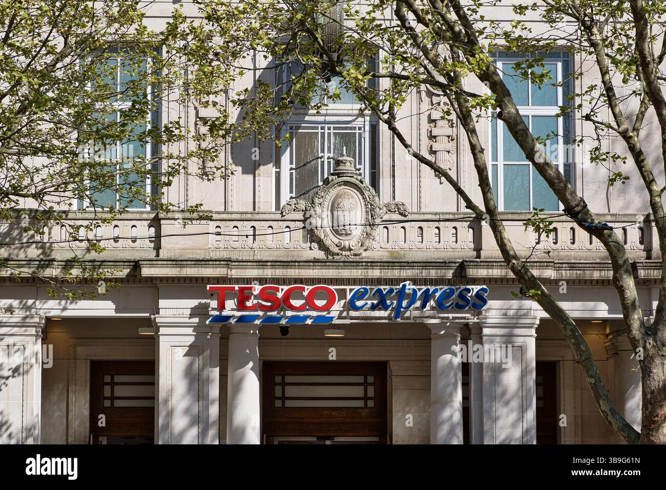 Facade of a Tesco Express store, with architectural details and ...