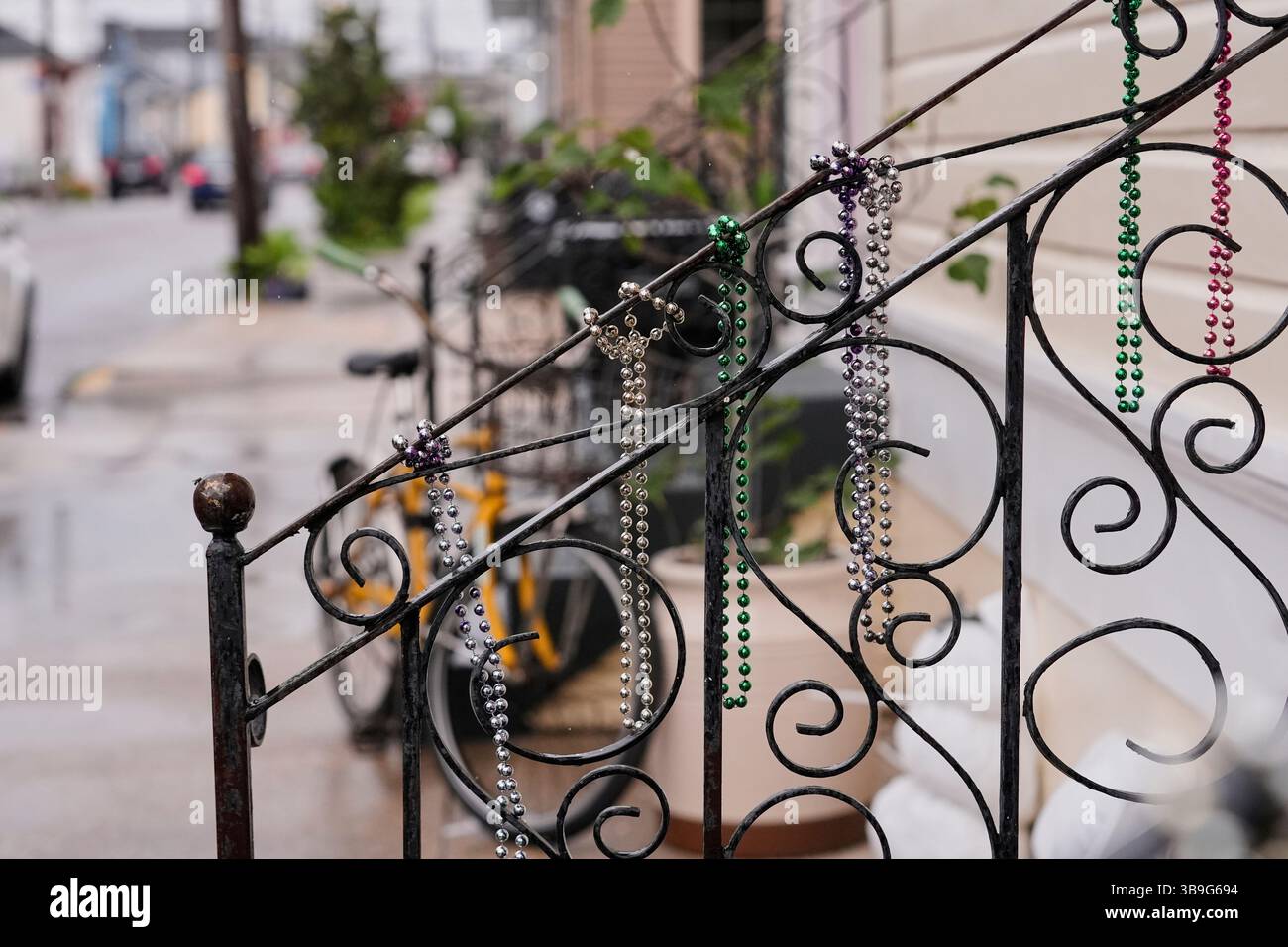 Mardi Gras beads hang in front of a home in the 7th Ward, Friday, May 9 ...