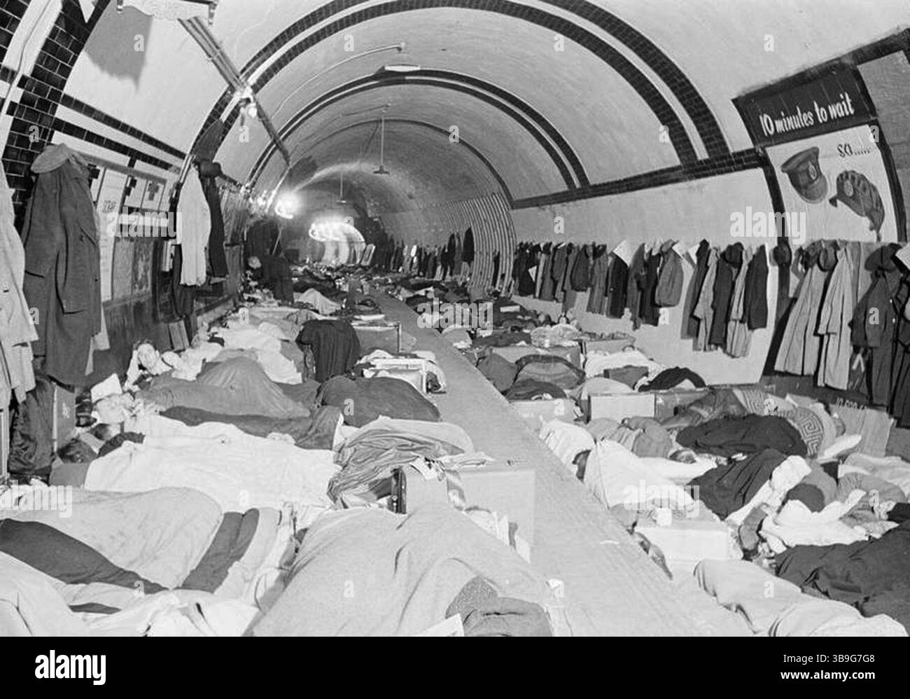 People settling in to sleep in a London Underground station during the ...