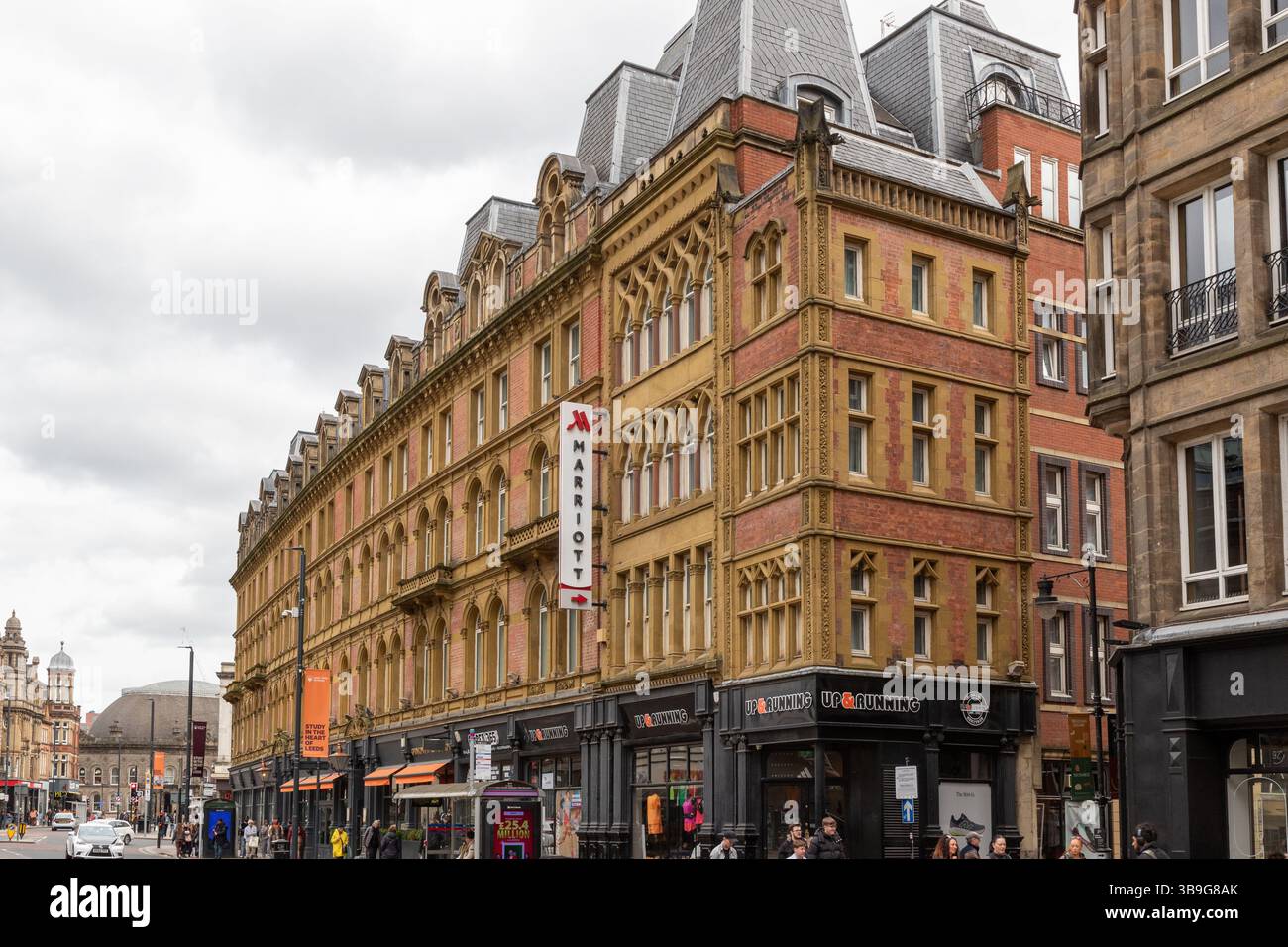 Exterior of a multi-story building with brick and stone facade ...