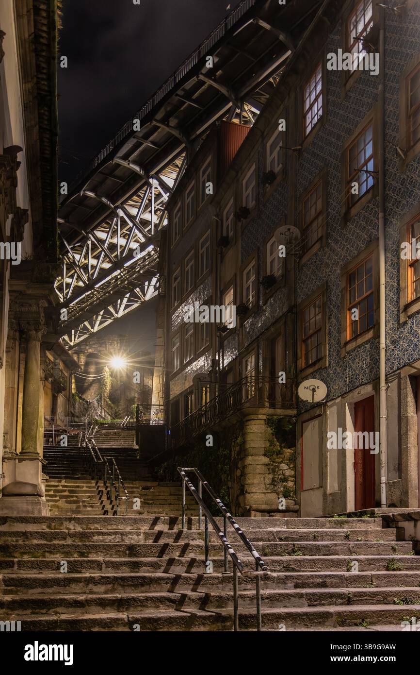Nighttime view of the steps in Escadas do Codecal. The Dom Luis I ...