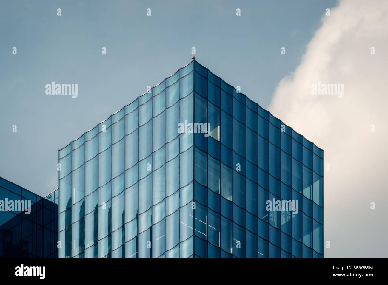 A contemporary glass office building under a clear sky in Colon City ...