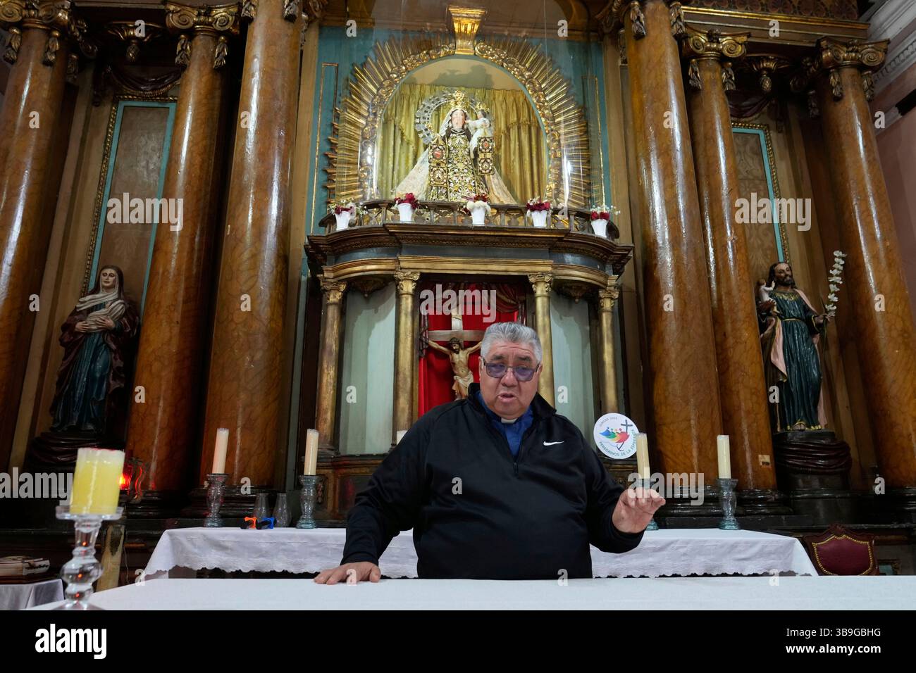 Father Jose Rosario speaks from the altar where Pope Leo XIV celebrated ...