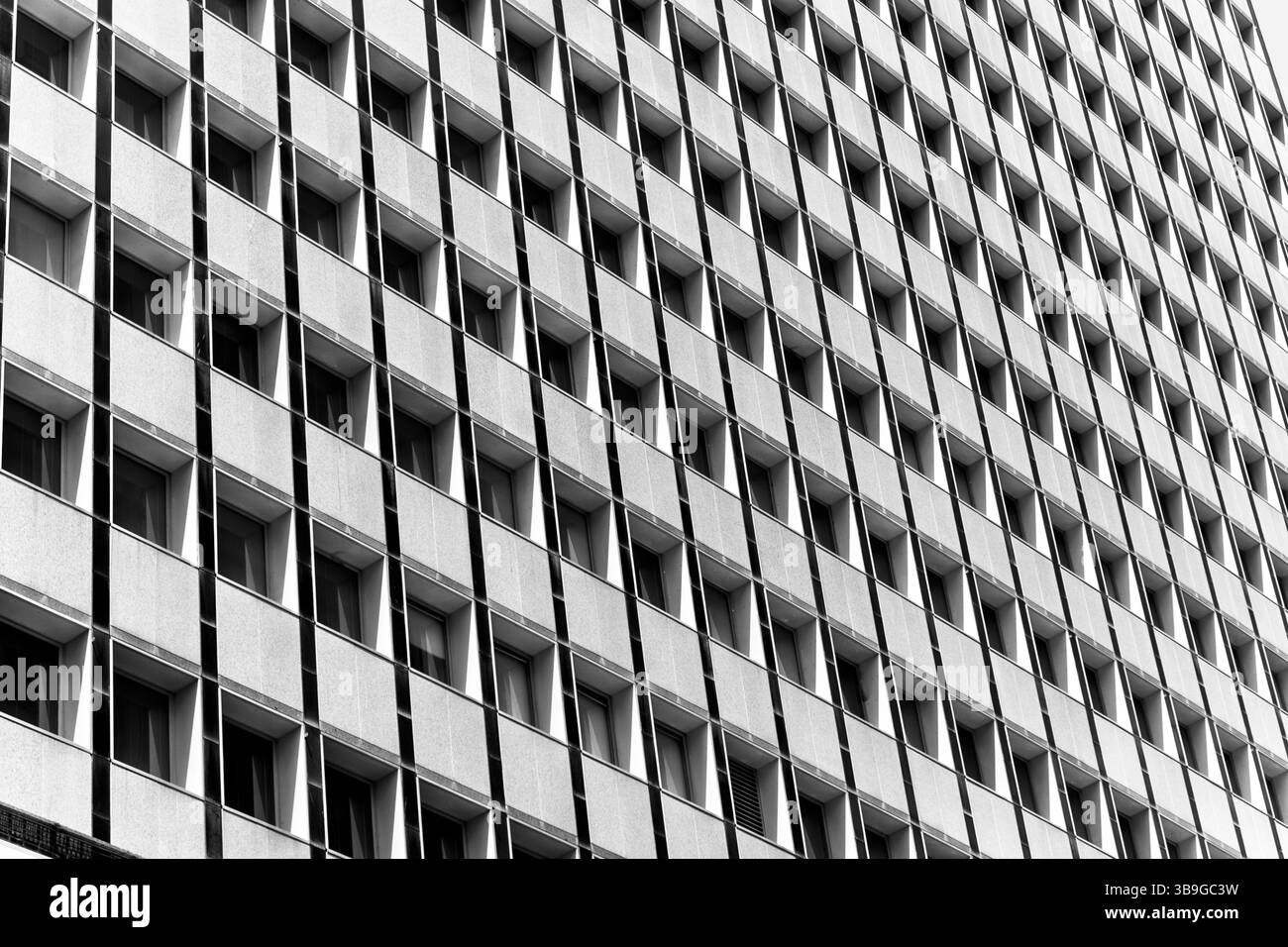 Black and white image of a building facade with repetitive square ...