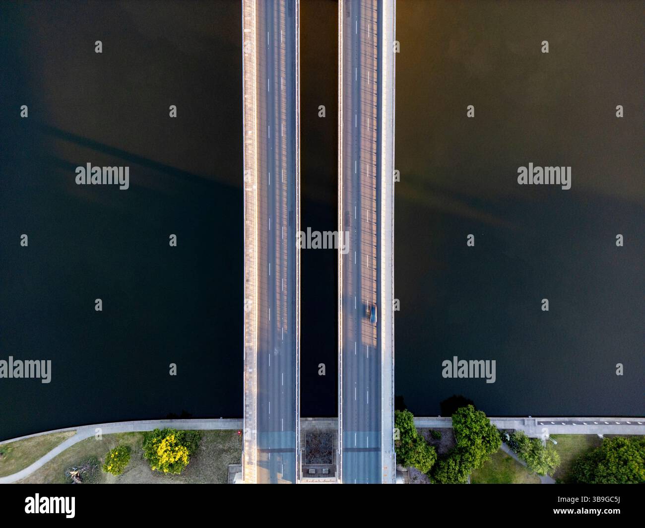 From above, a drone captures the striking image of two parallel bridges ...