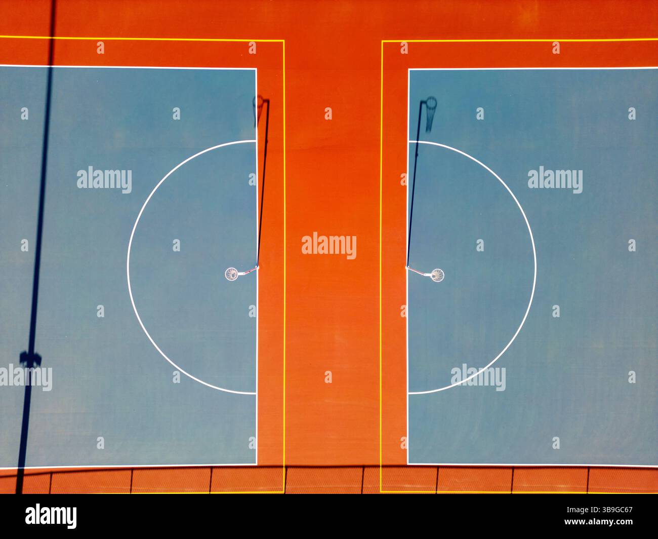 Top view capturing the vibrant, perfectly aligned netball courts in ...