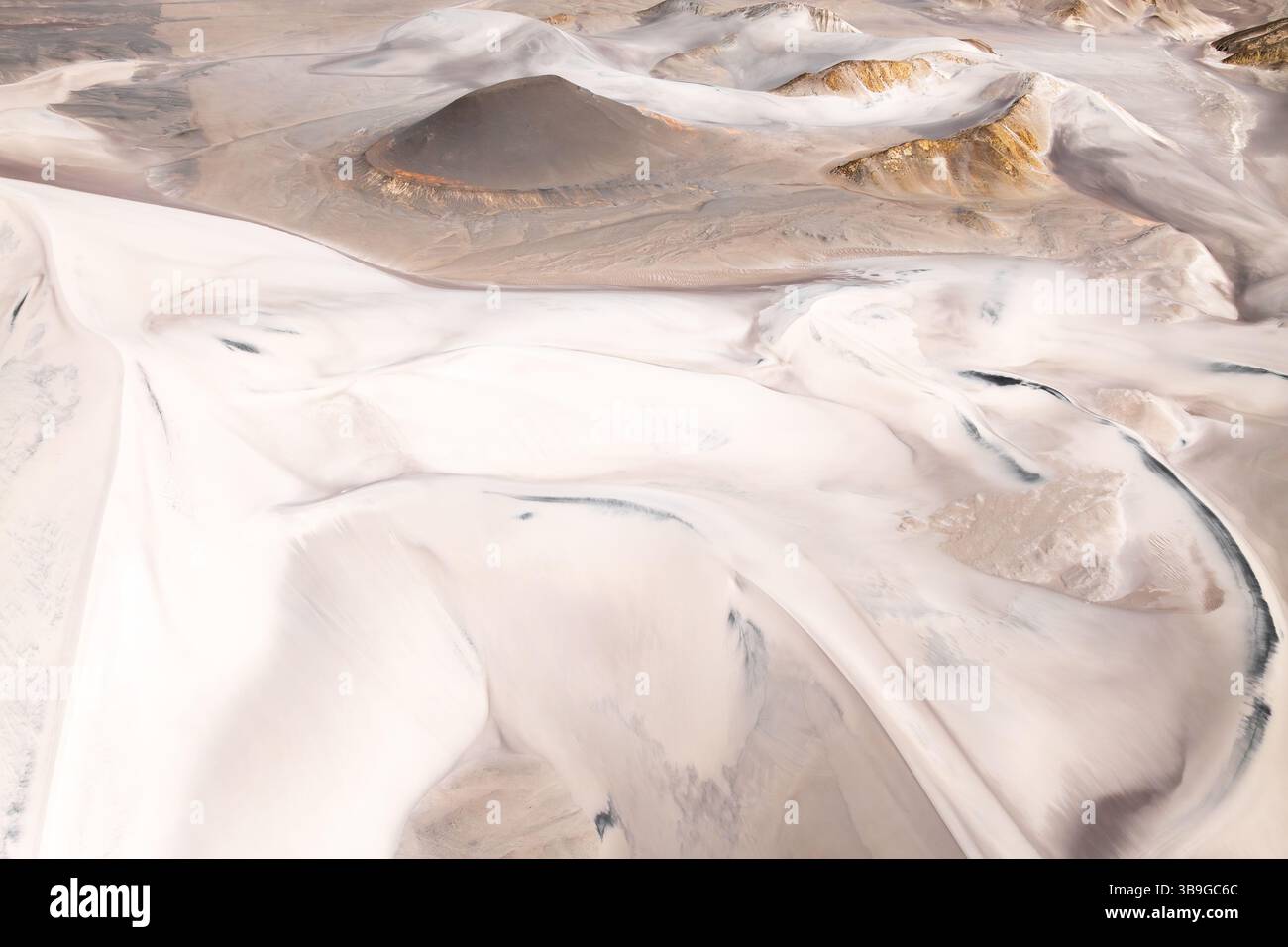 Aerial capture of a desolate desert landscape surrounded by sweeping ...