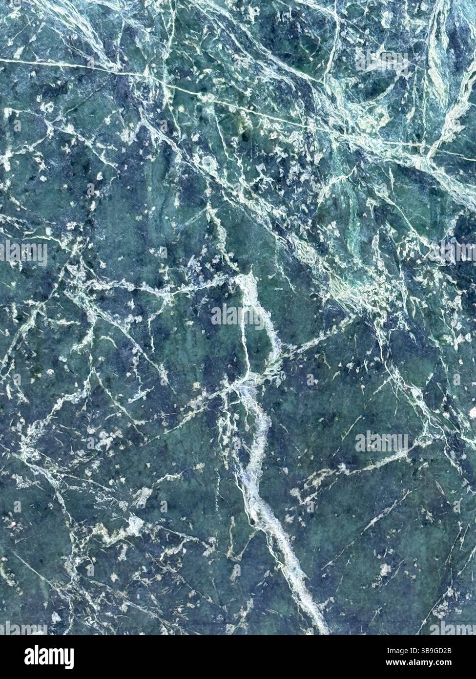 Green marble texture featuring intricate white veining patterns ...