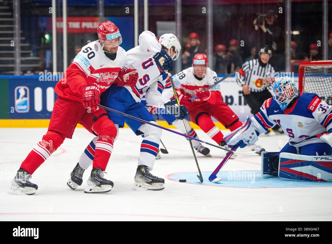 Denmark's Mathias Bau, left, and Mason Lohrei of the USA and goalkeeper ...