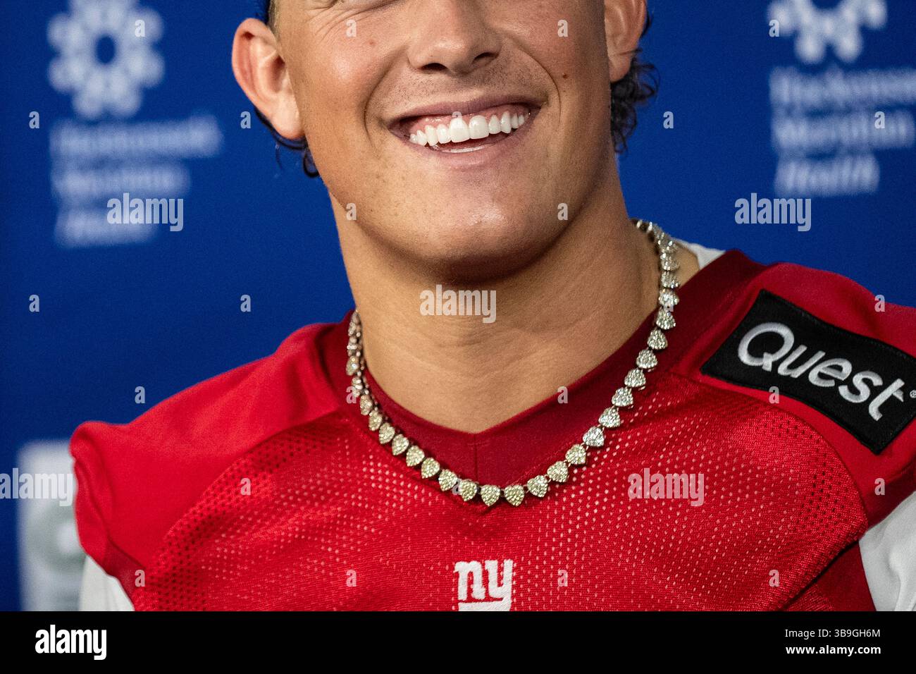 New York Giants quarterback Jaxson Dart wears a necklace with hearts ...