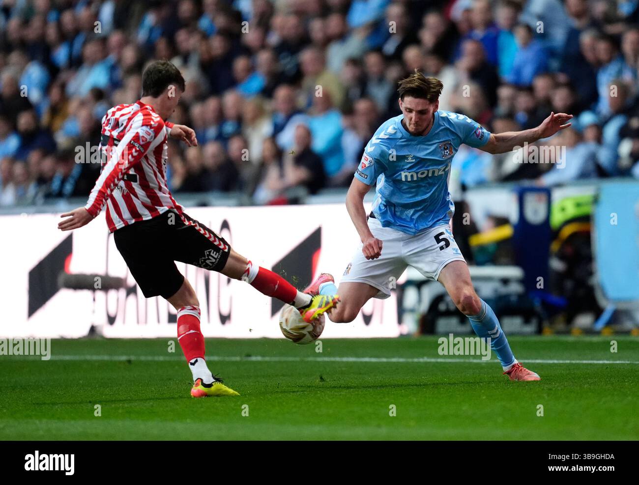 Sunderland's Trai Hume (left) and Coventry City's Jack Rudoni battle ...