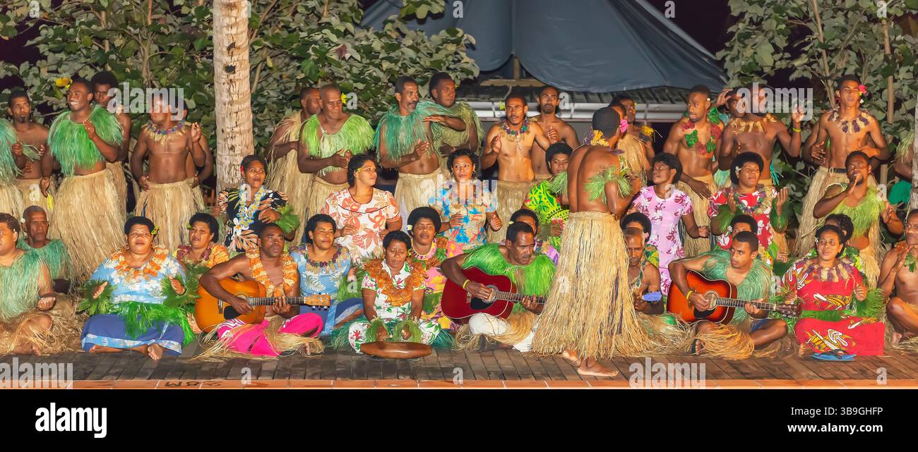 Fijians in traditional dress performing during a Kava ceremony, Waya ...