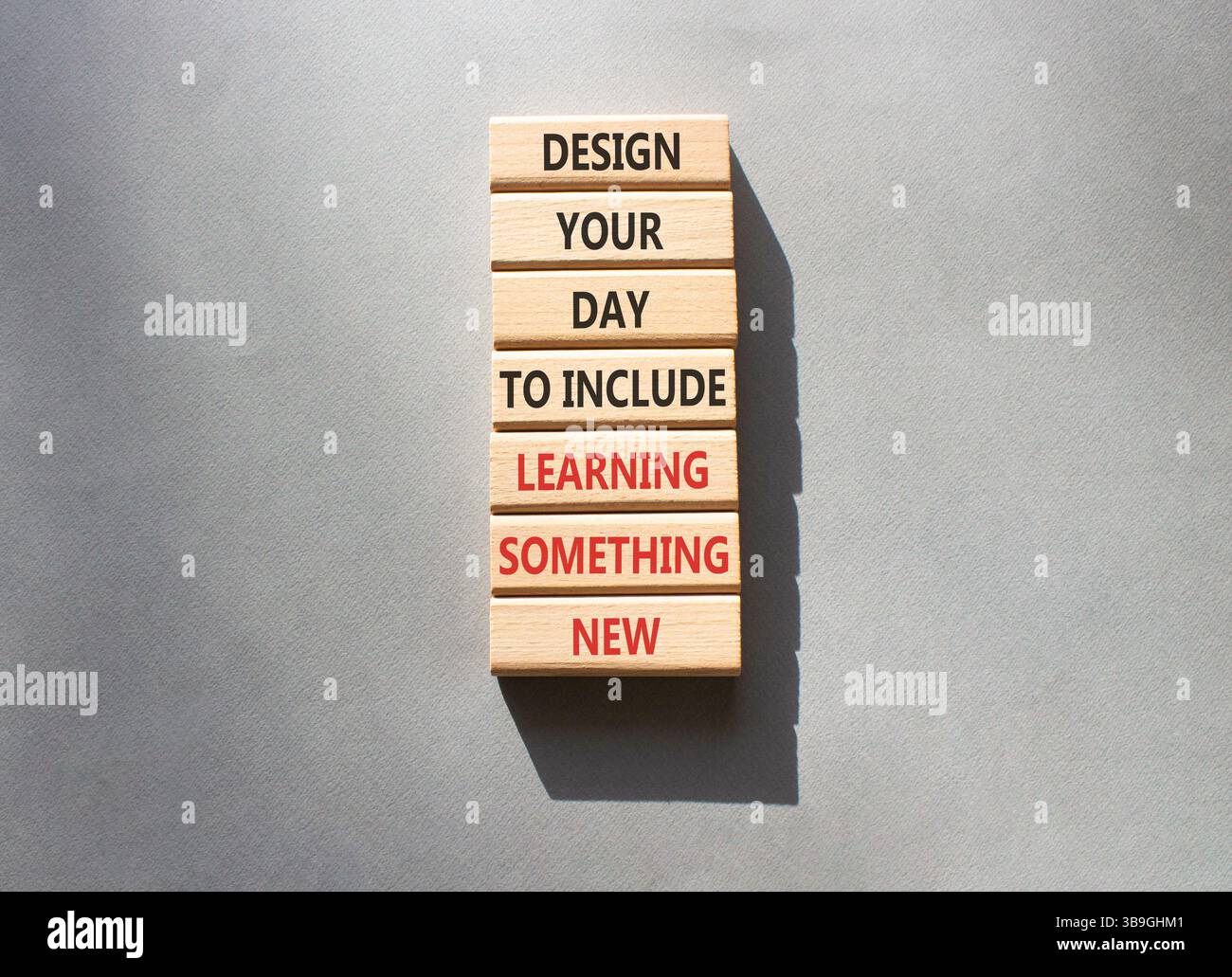 Learning symbol. Wooden blocks with words Design your day to learn ...