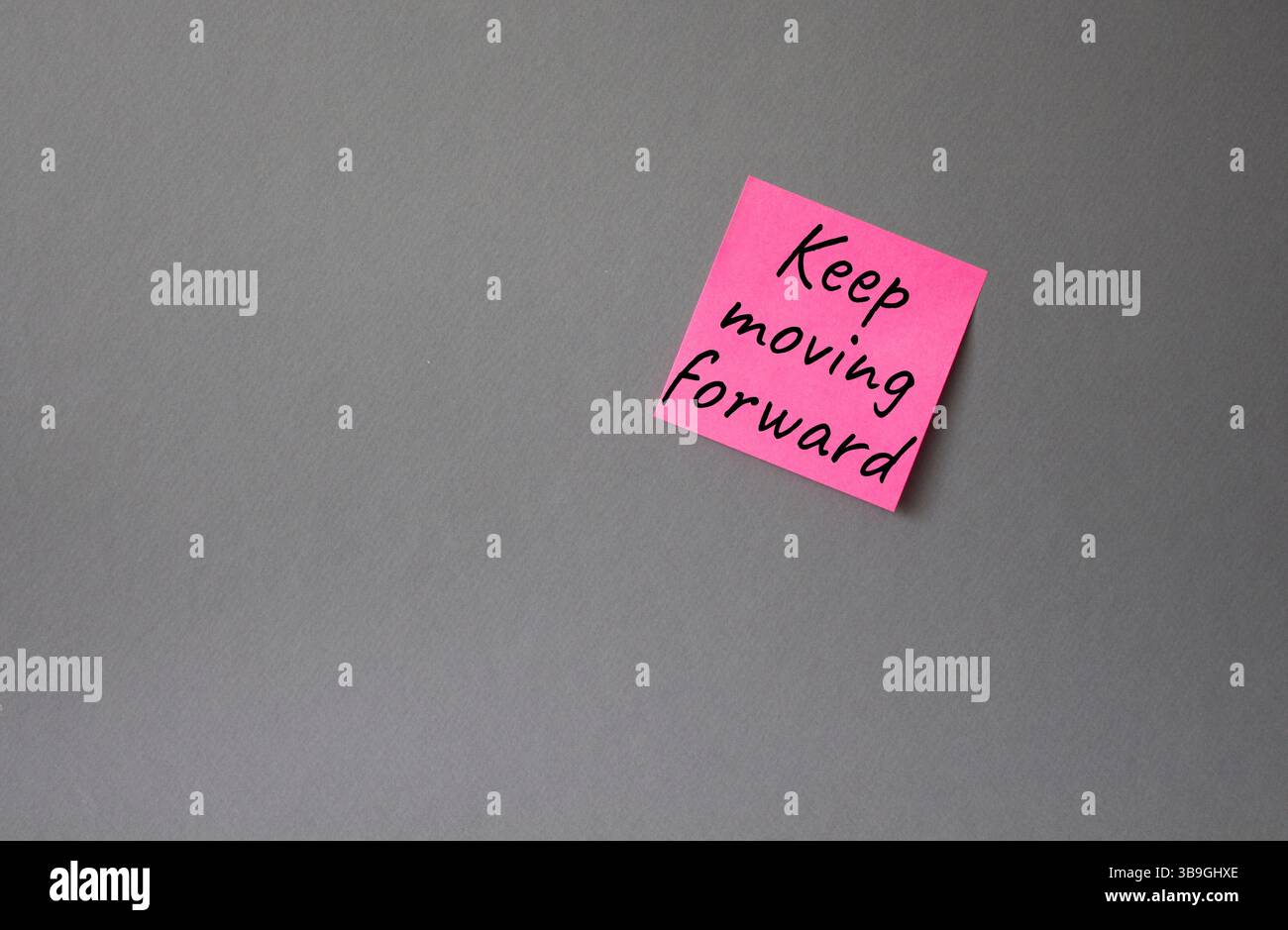 Keep moving forward symbol. Concept words keep moving forward on pink ...