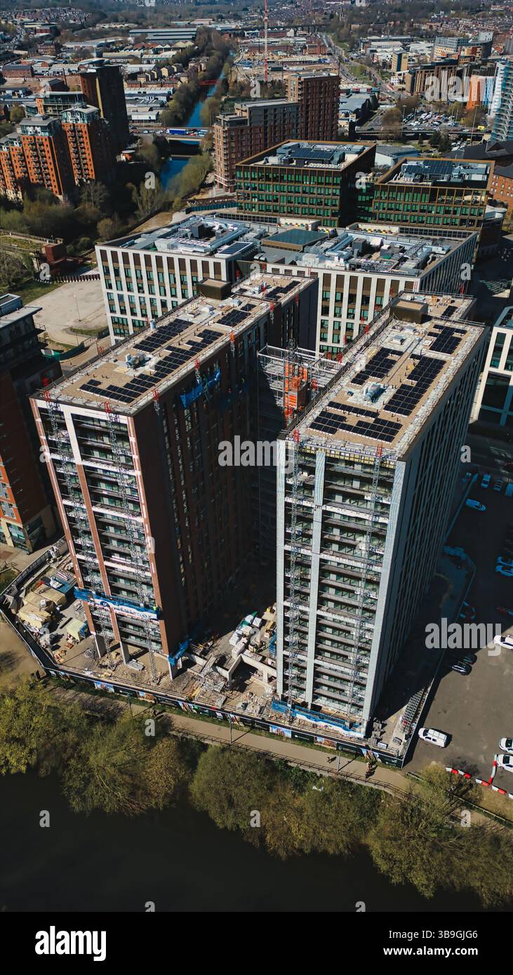 Aerial view showcases modern apartment buildings, some under ...