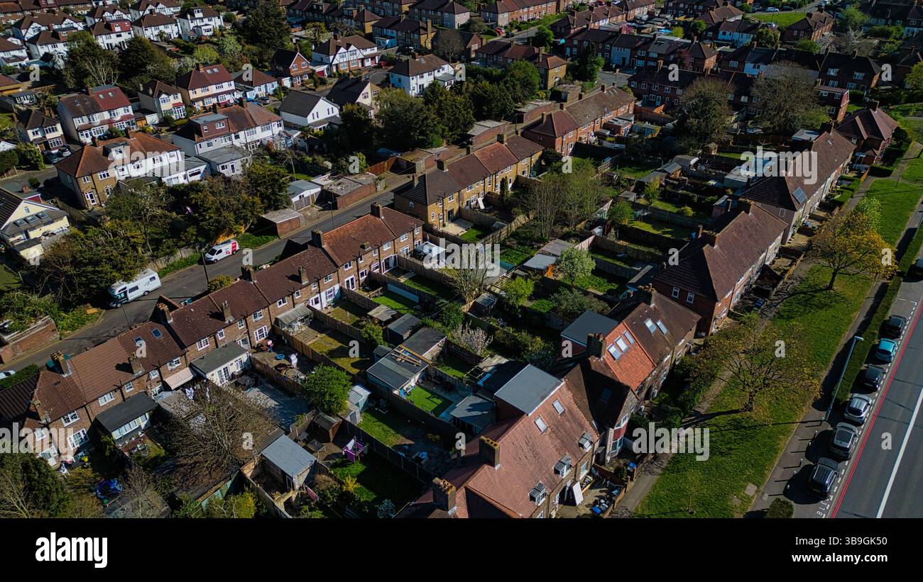 Aerial view of a suburban neighborhood featuring rows of houses with ...