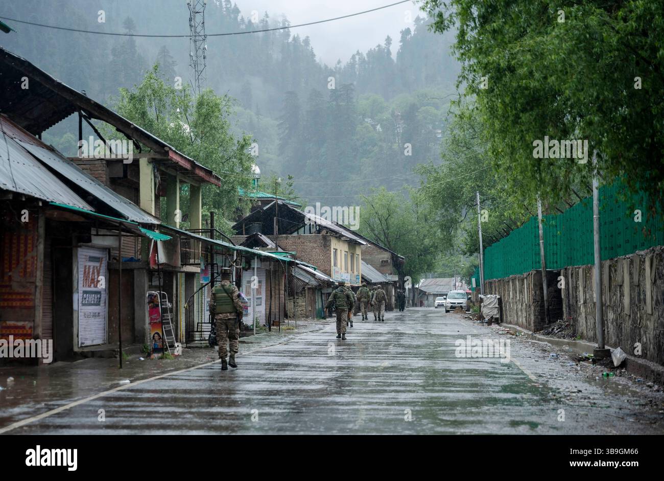 Indian security forces patrol a deserted market in Uri, a town near the Line of Control (LoC ...