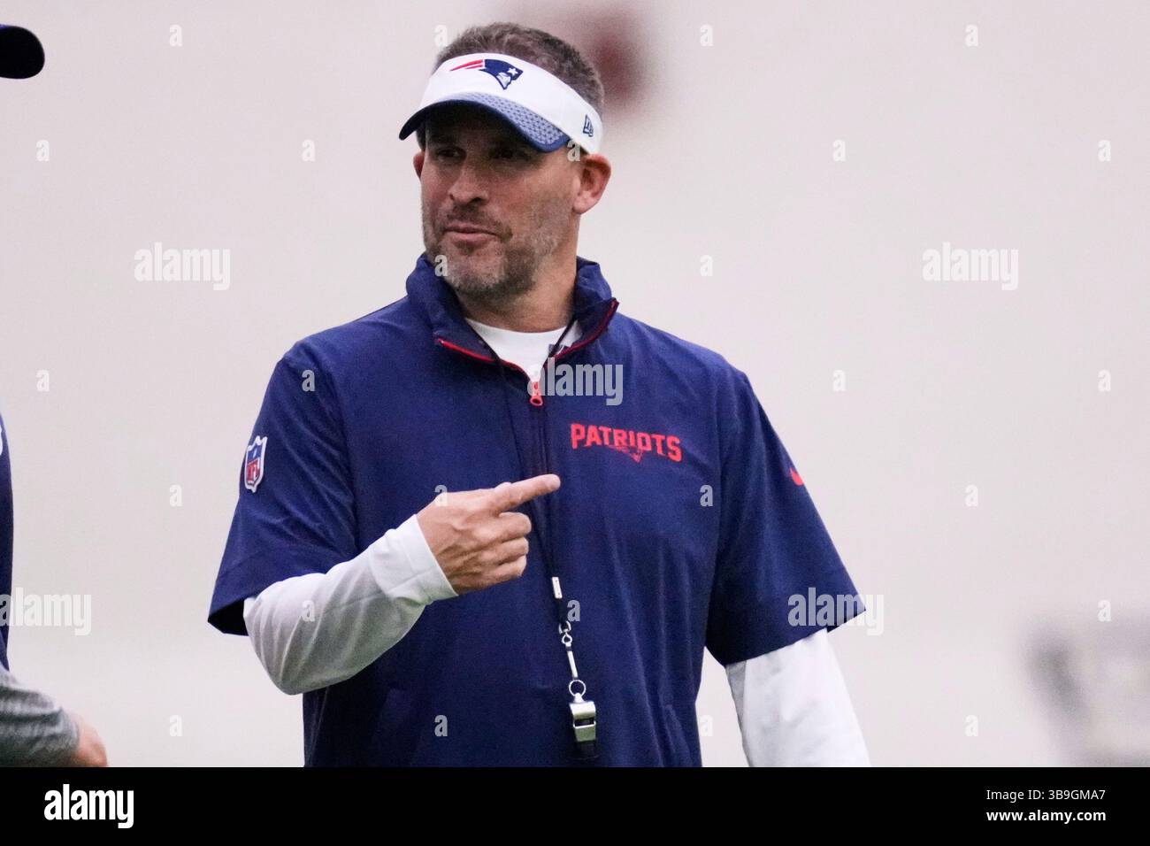 New England Patriots offensive coordinator Josh McDaniels gestures during the NFL football team ...
