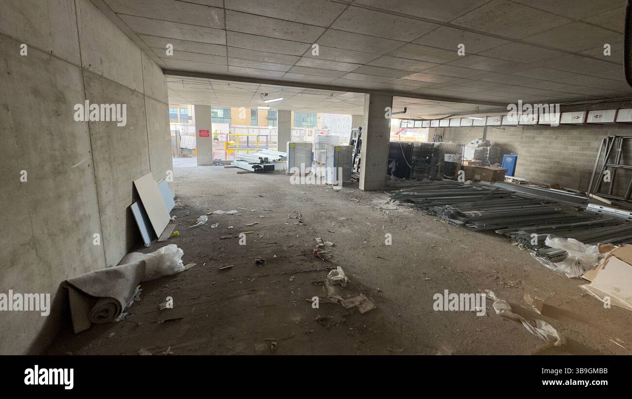 Construction site interior with concrete walls, ceiling, floor and ...