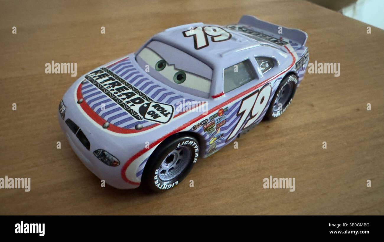 Lilac toy race car with number 79, 'Retread' logo, and cartoon eyes, on ...