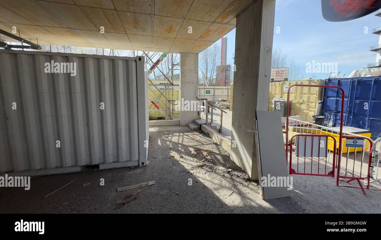 Construction site view under concrete ceiling. Featuring shipping ...
