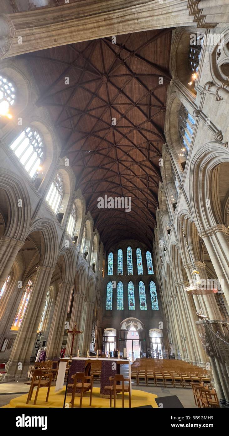 Interior view of a cathedral featuring Gothic architecture, wooden ...