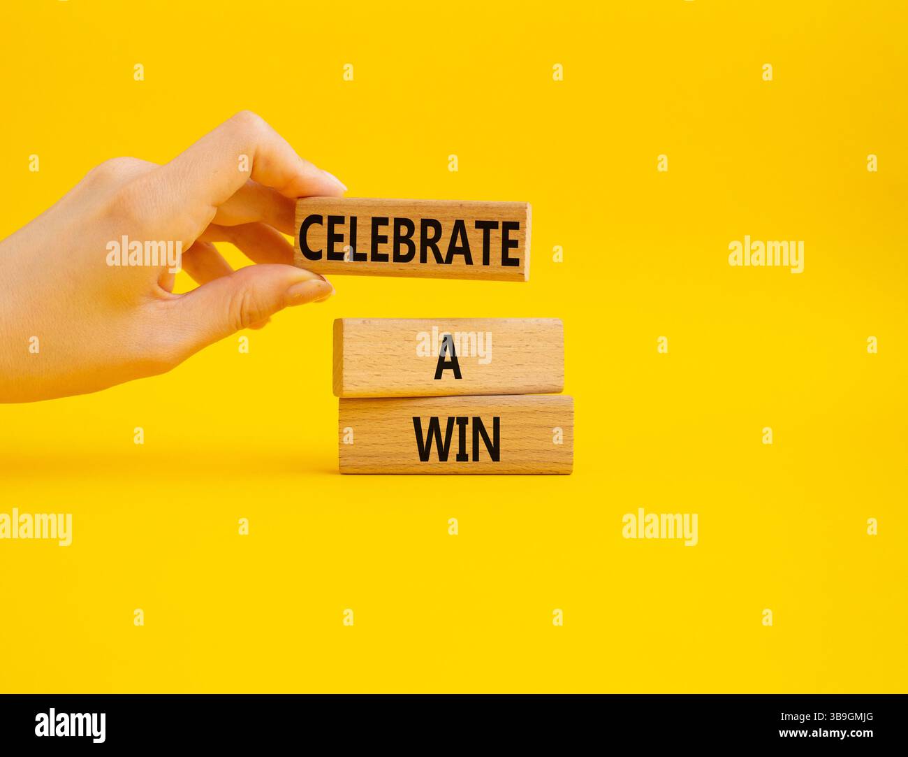 Celebrate a win symbol. Concept words Celebrate a win on wooden blocks ...