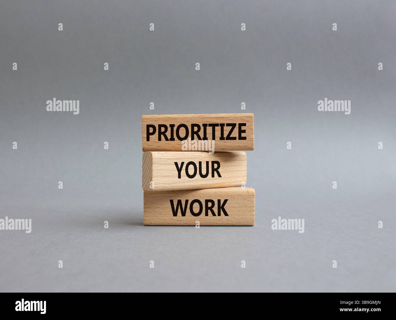 Priority symbol. Wooden blocks with words 'Prioritize your work ...