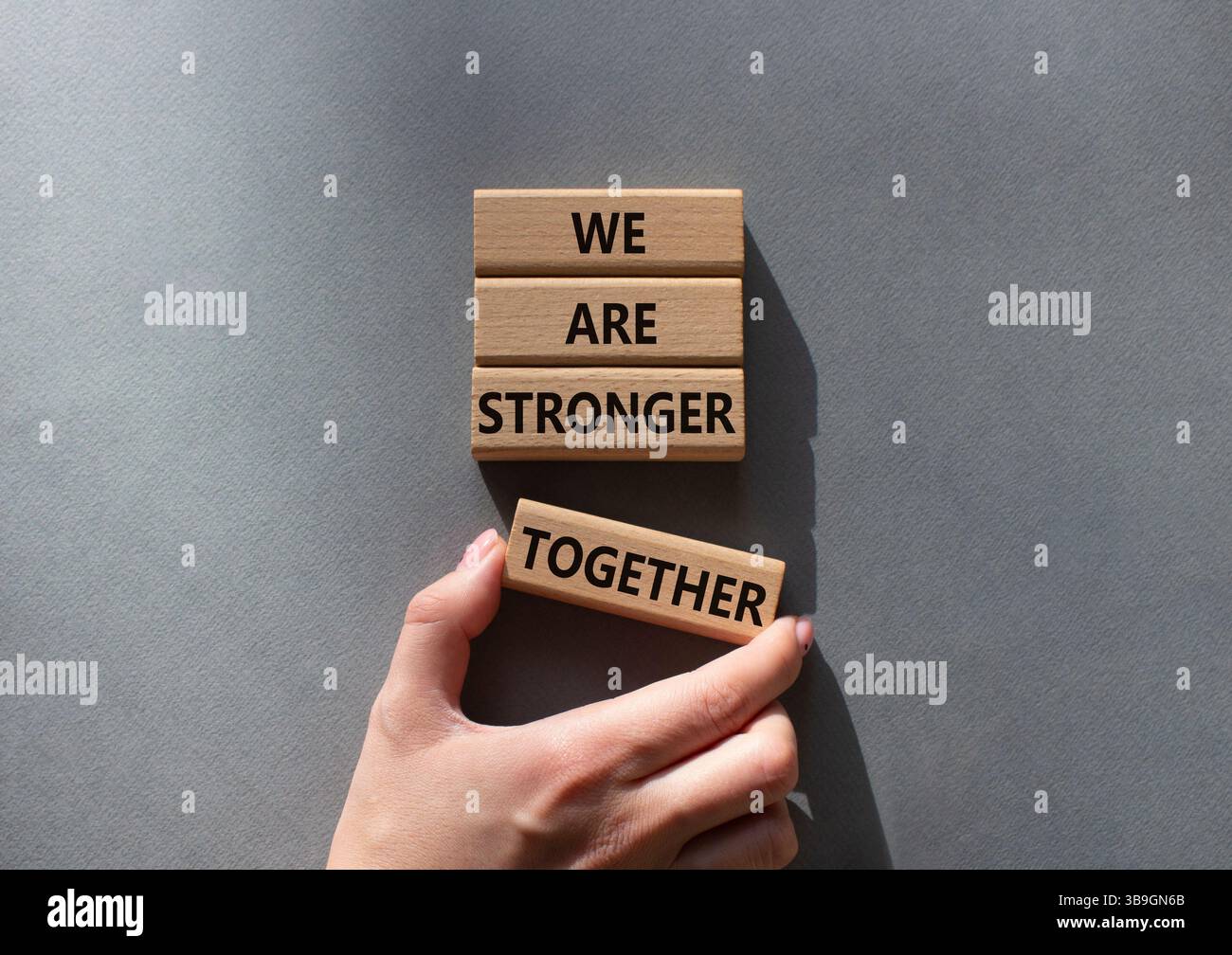 We are stronger together symbol. Wooden blocks with words We are ...