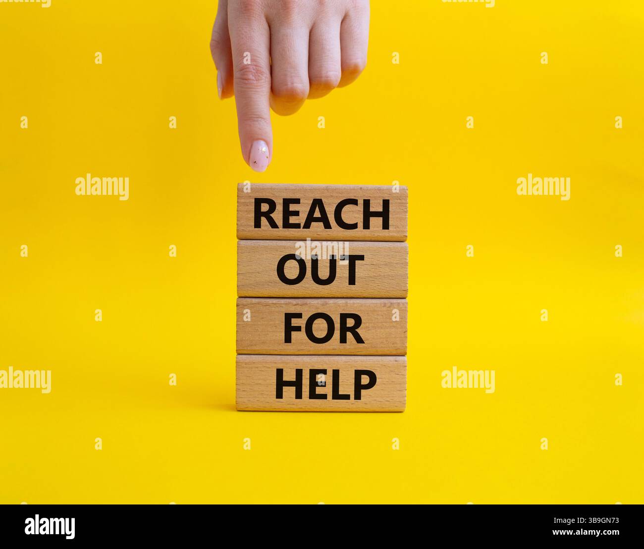 Reach out for help symbol. Wooden blocks with words Reach out for help ...