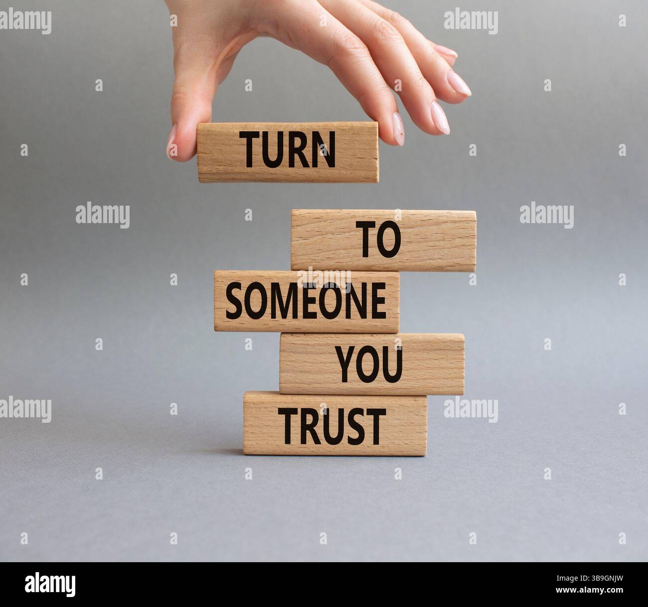 Turn to Someone you trust symbol. Wooden blocks with words Turn to ...