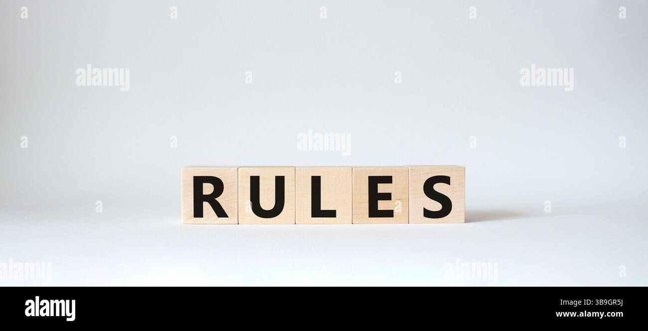 Rules symbol. Wooden cubes with word Rules. Beautiful white background ...
