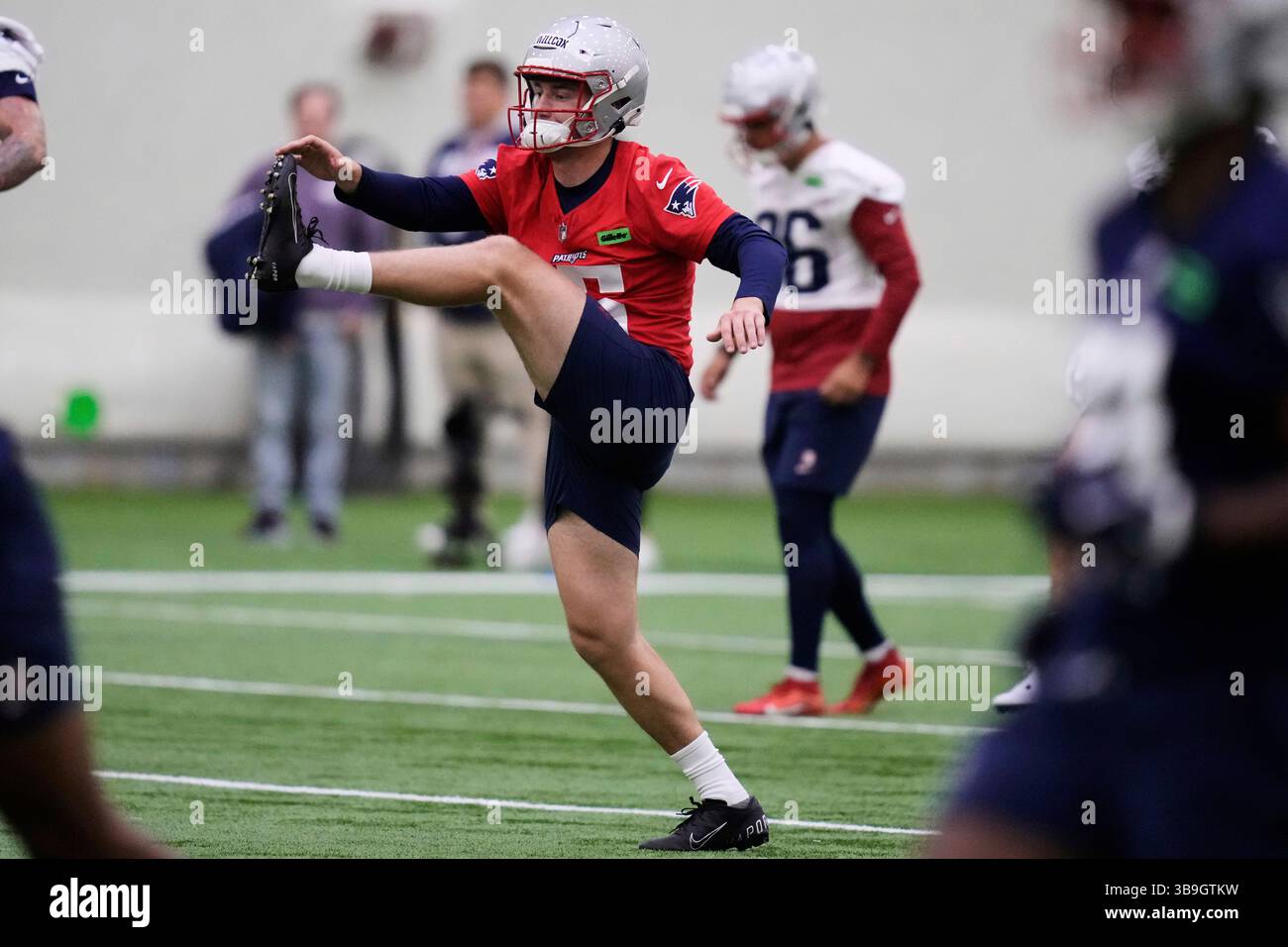 New England Patriots quarterback Jake Wilcox warms up during the NFL ...