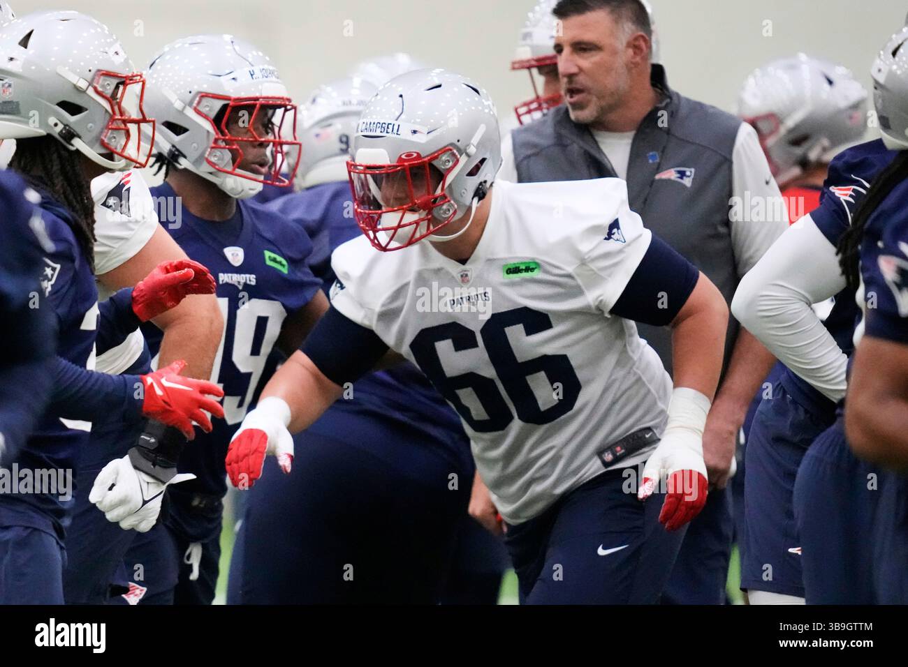 New England Patriots tackle Will Campbell (66) runs past head coach ...