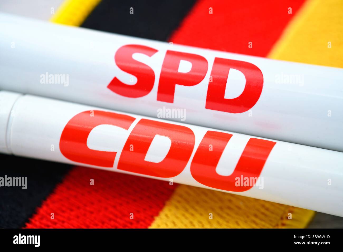 Ballpoint pen of cdu and spd on german flag hi-res stock photography ...