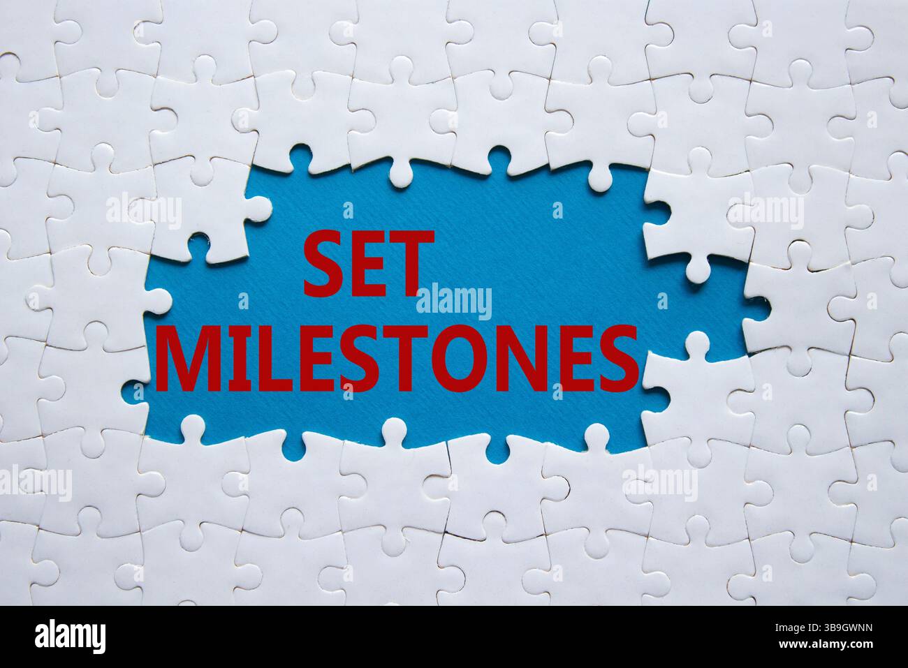 Set milestones symbol. Concept word Set milestones on white puzzle ...