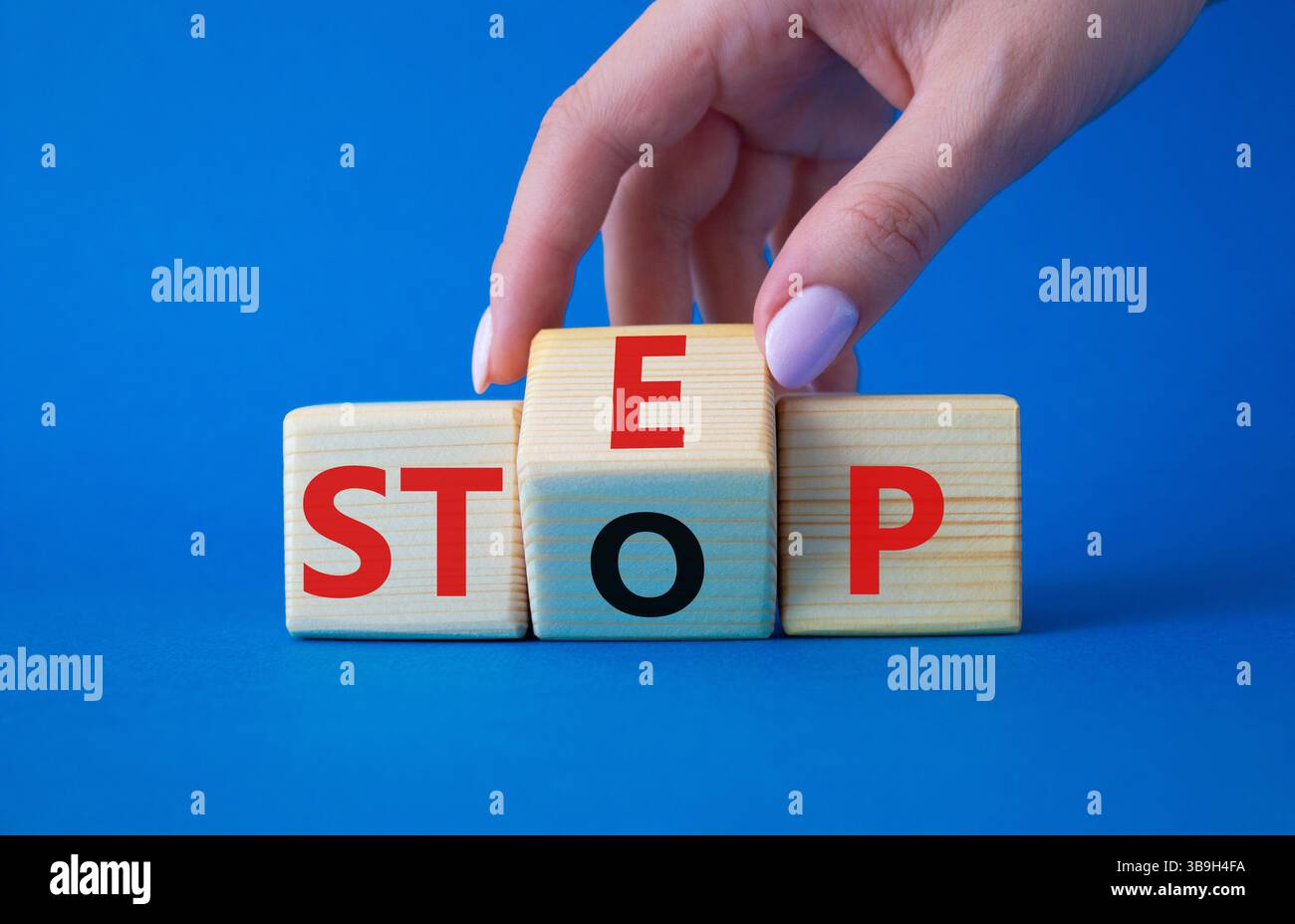 Step vs Stop symbol. Businessman hand turns wooden cubes and changes ...
