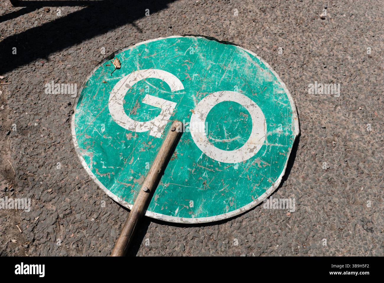 A roadworks manual traffic control hand sign Stock Photo - Alamy